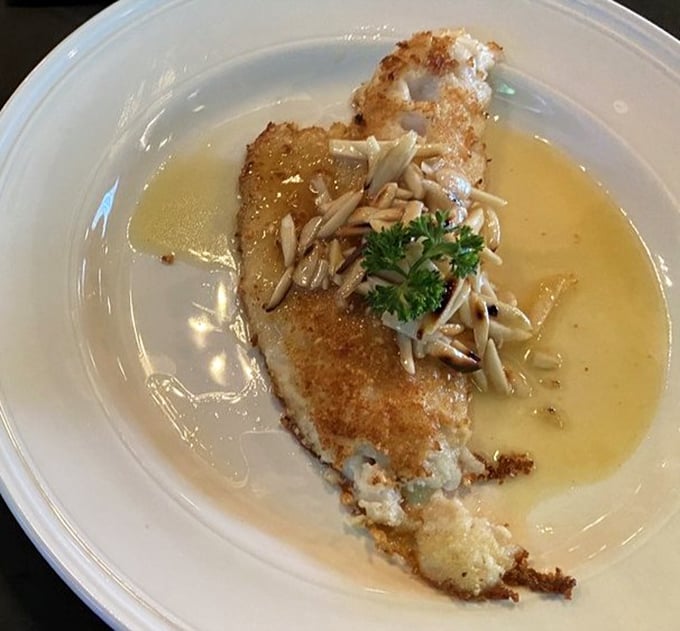 Almond-crusted walleye swimming in butter sauce—proof that Wisconsin knows fish better than coastal elites would ever admit.