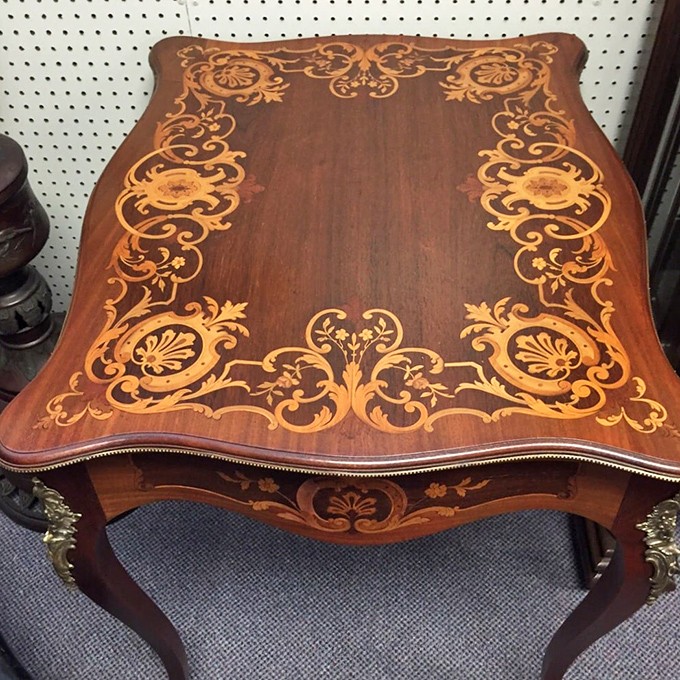 This isn't just a table—it's functional artwork with inlays so intricate they'd make today's furniture designers weep with inadequacy.