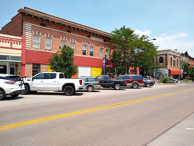 Colorful storefronts welcome shoppers along Main Street, where local businesses thrive without the inflated prices of tourist traps.