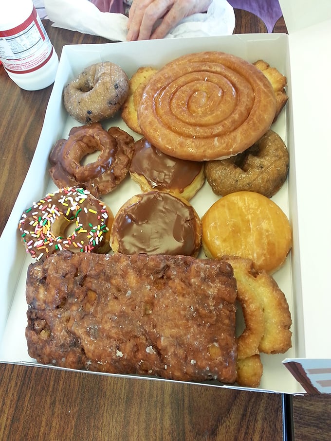 The holy grail of donut boxes—where cinnamon rolls, chocolate-glazed treasures, and that magnificent apple fritter coexist in perfect, caloric harmony.