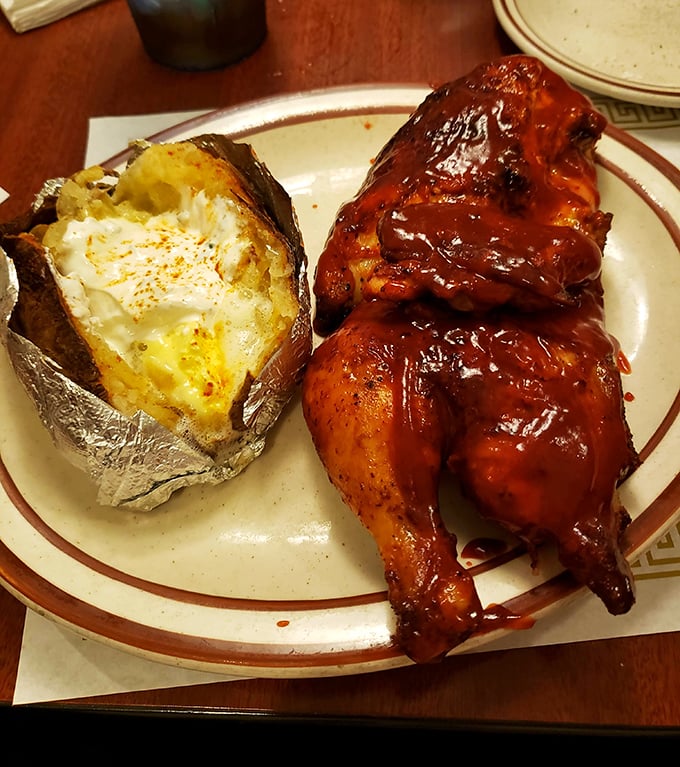 BBQ chicken nirvana achieved! That mahogany-colored skin, that tender meat, that loaded baked potato—this plate is why napkins were invented.