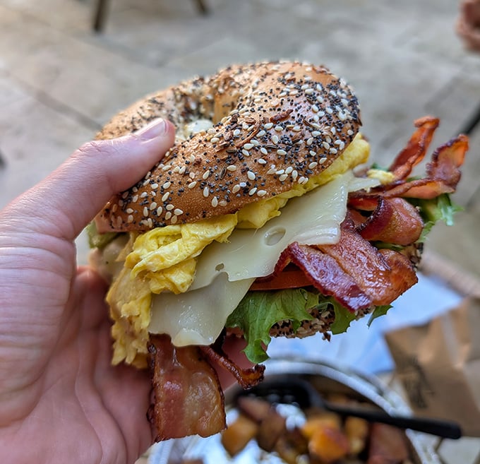 This everything bagel sandwich doesn't just break fast—it shatters it with layers of bacon, egg, and cheese in perfect harmony.