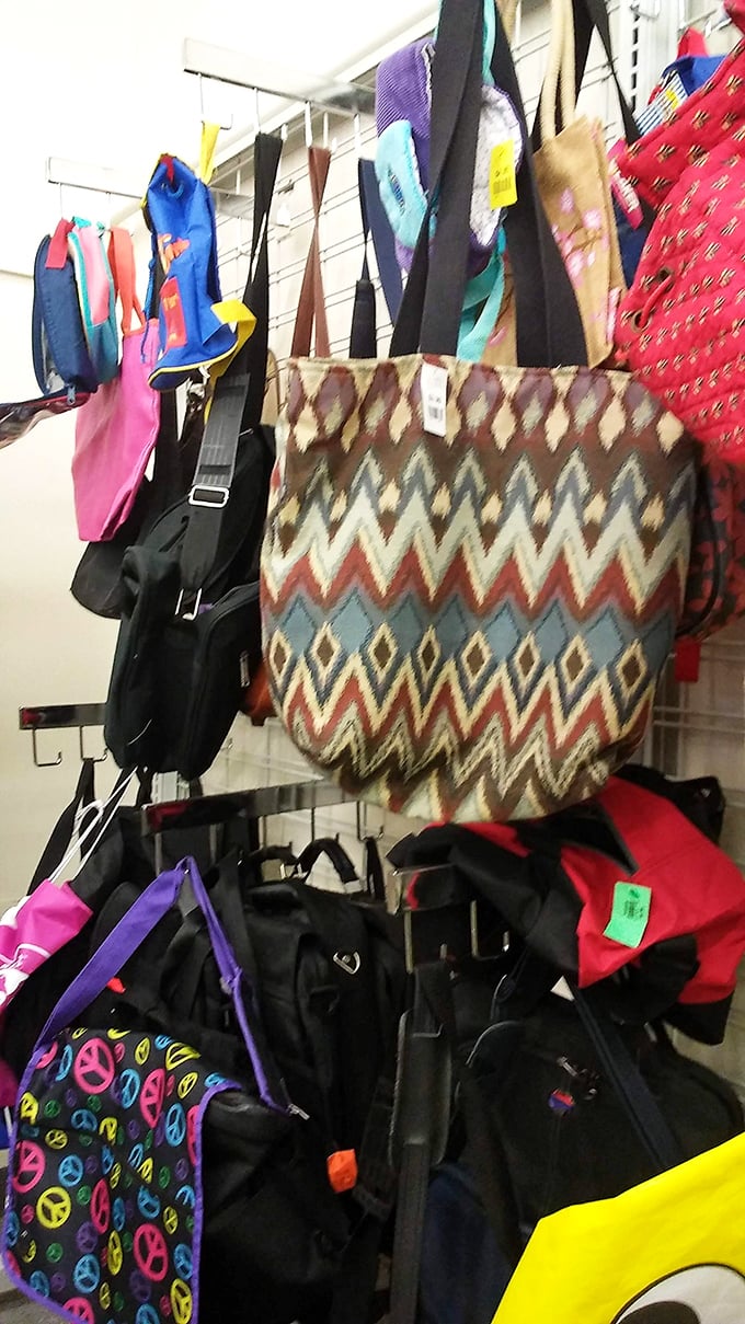 Bags hang like colorful flags of surrender to the irresistible force of a good bargain.