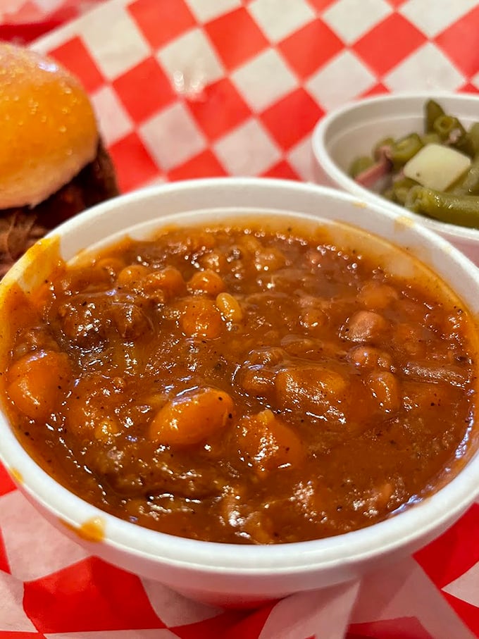 These baked beans have clearly been introduced to some smoky pork. Not your average side dish—more like a supporting actor stealing the show.