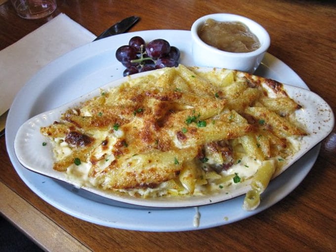 That golden, bubbling mac and cheese has more layers than a good mystery novel and twice the satisfaction factor.