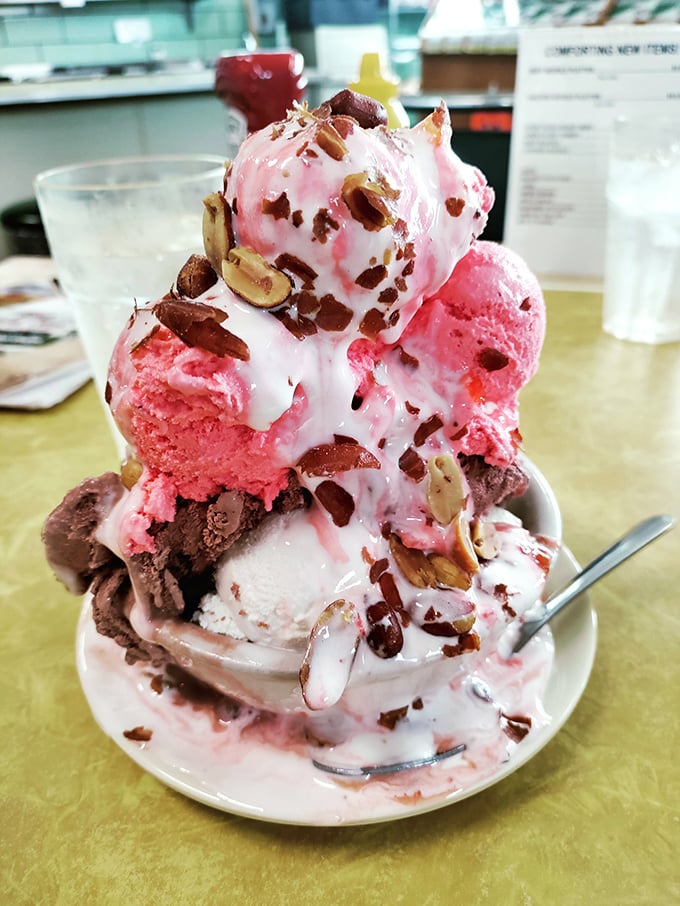 The architectural marvel that is Tom's strawberry sundae—where pink meets chocolate in a tower of happiness that defies both gravity and restraint.