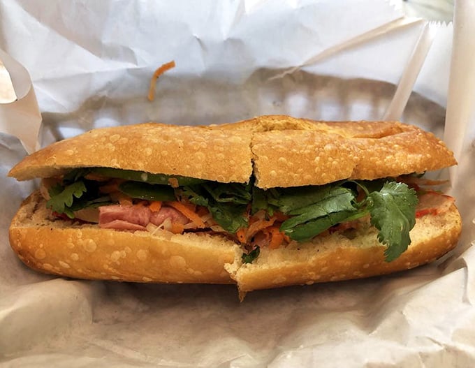 The bánh mì at Mi Li is architectural perfection—crispy exterior, fresh fillings, and that crucial balance of savory meat, bright herbs, and tangy vegetables.