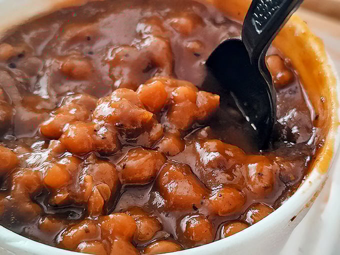 These aren't your average baked beans—they're more like bean candy, swimming in a sauce that's been plotting deliciousness for hours.
