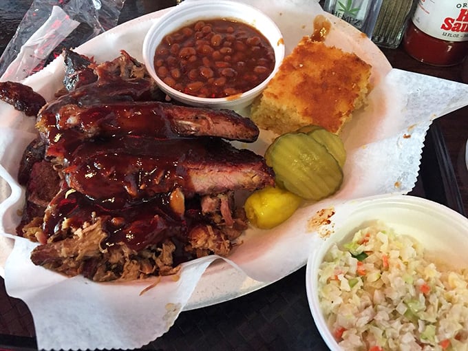 Barbecue nirvana on butcher paper – ribs, pulled meat, cornbread, and sides creating the perfect harmony. This isn't a meal; it's a symphony.
