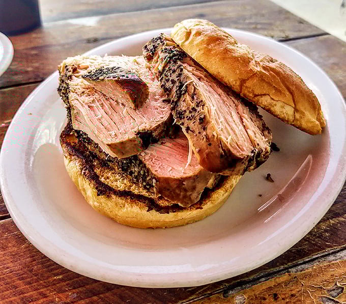 The brisket sandwich doesn't just have a smoke ring—it has a smoke halo. Sliced thick enough to remind you life is worth living.