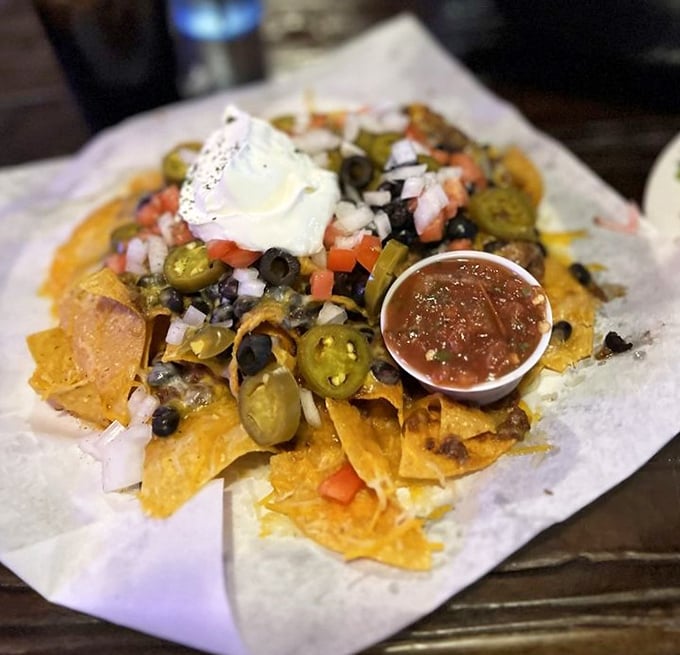 These loaded nachos aren't just a appetizer, they're an architectural achievement of cheese, jalapeños, and all the fixings your heart desires.