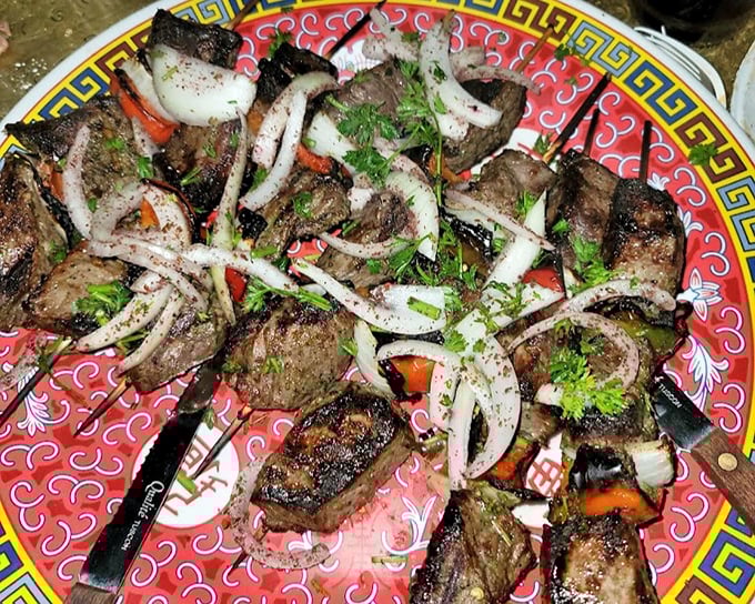 These beef kabobs aren't just grilled—they're a carnivore's dream, kissed by flames and topped with a confetti of fresh herbs and onions.