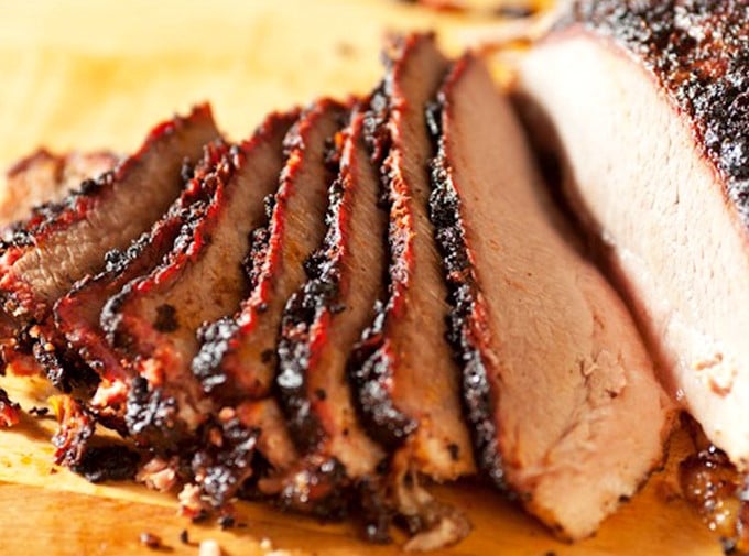 Brisket sliced so perfectly you could frame it. That smoke ring isn't just for show—it's the barbecue equivalent of a Michelin star.
