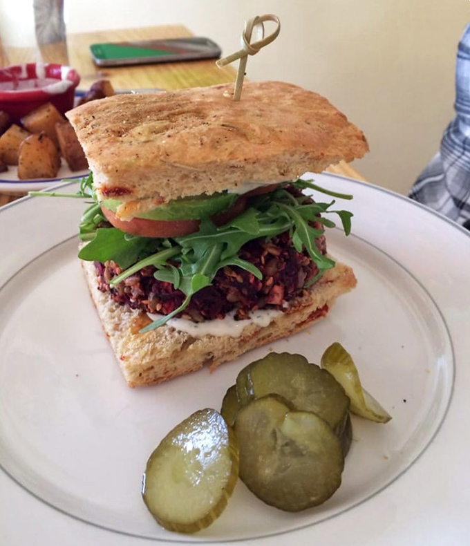 This beet burger doesn't apologize for being meatless—it stands tall, proud, and delicious between artisanal bread with all the proper fixings.