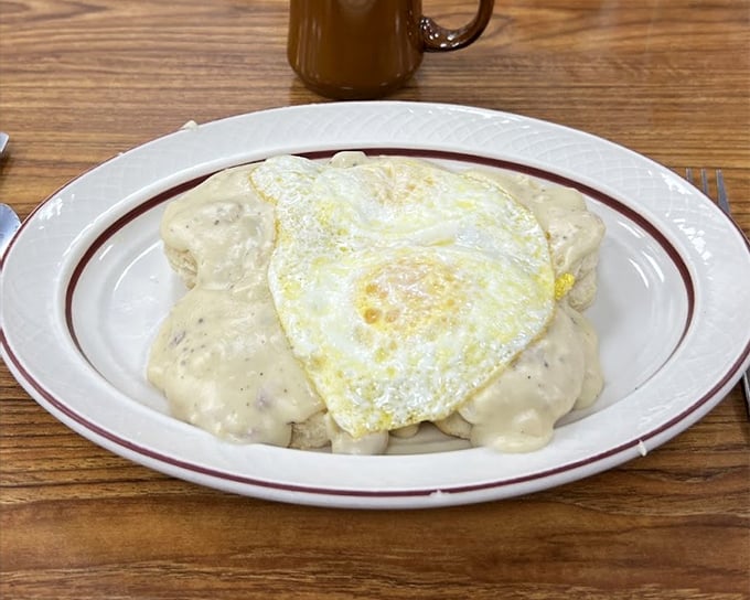 Biscuits and gravy topped with a sunny-side-up egg – the breakfast equivalent of hitting the jackpot. Comfort food that hugs you from the inside.