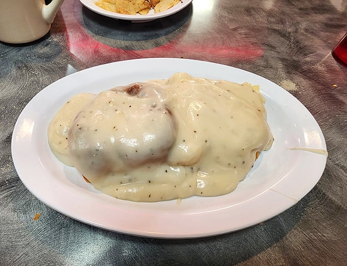 Biscuits and gravy so good they should require a permission slip. That velvety blanket of country gravy doesn't just cover the biscuits – it transforms them.