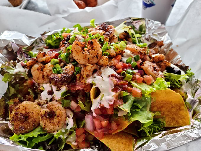 A fiesta of flavors! Blackened shrimp perched atop a mountain of nachos—proof that Florida and Mexico should collaborate more often.
