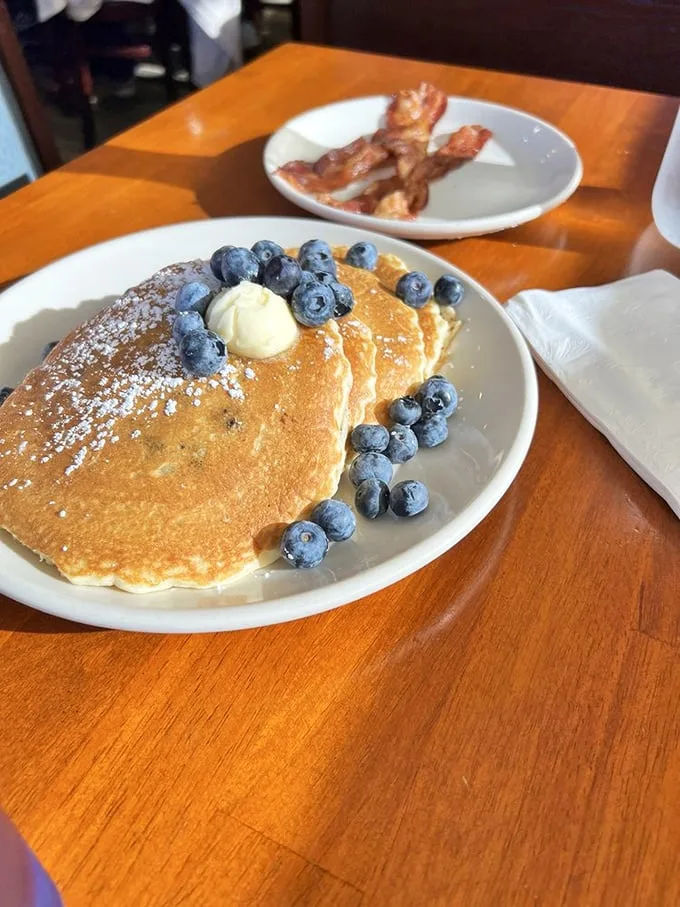 Blueberry pancakes that actually taste like blueberries—revolutionary concept! The butter melts like your resolve to "just have coffee."
