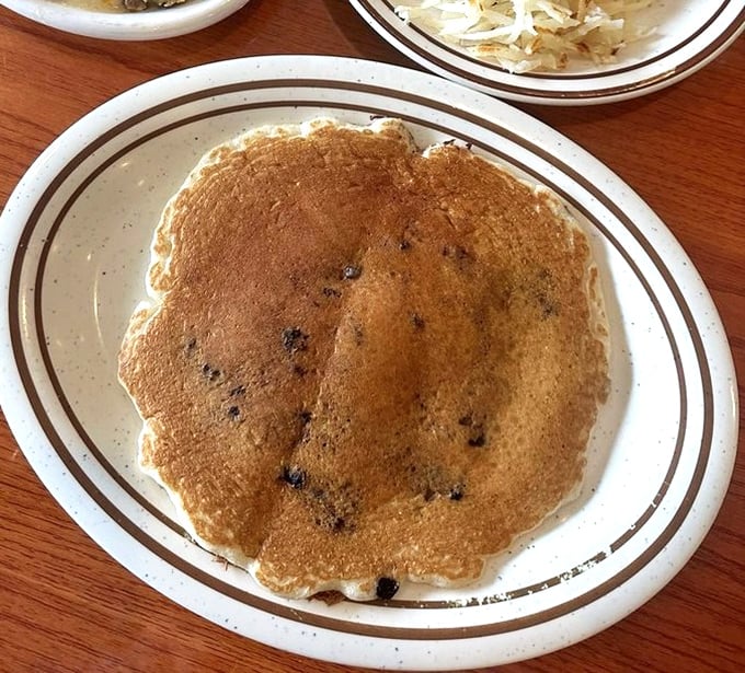 This blueberry pancake isn't just breakfast, it's edible nostalgia—the kind that makes you wonder why you ever bothered with cereal.