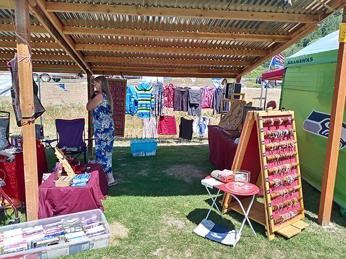 Under a rustic wooden shelter, DVDs and clothing create the ultimate analog shopping experience—no "add to cart" button required. 