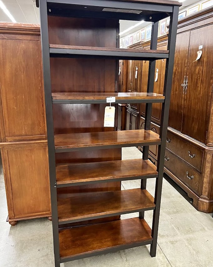 Industrial-meets-rustic bookshelves flanked by vintage wardrobes – perfect for both your paperbacks and that secret passage to Narnia.
