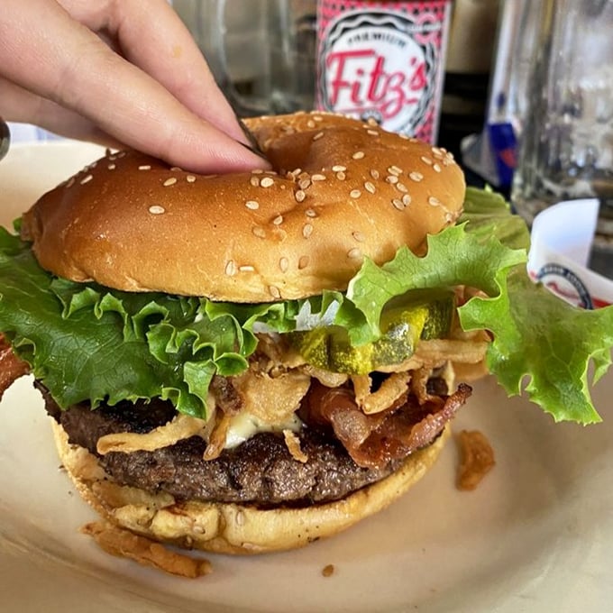 This Bourbon Burger isn't just food—it's architecture. Layers of flavor stacked so beautifully you almost feel guilty dismantling it. Almost.