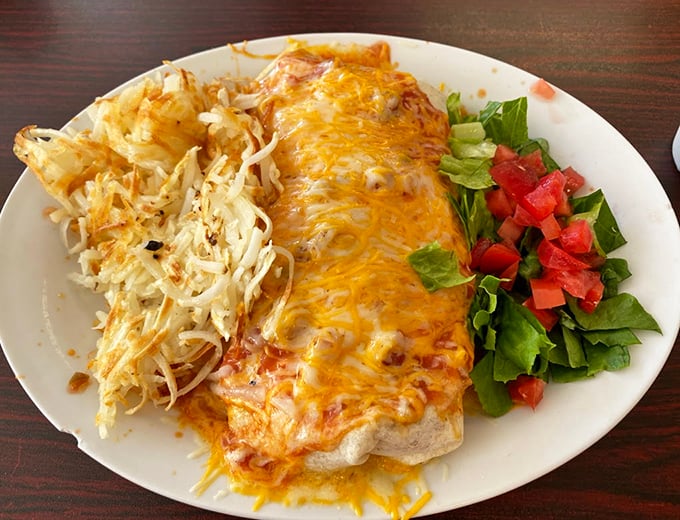 This burrito isn't just wrapped, it's embraced by melted cheese. The side of hash browns and fresh salad makes this a vacation on a plate.