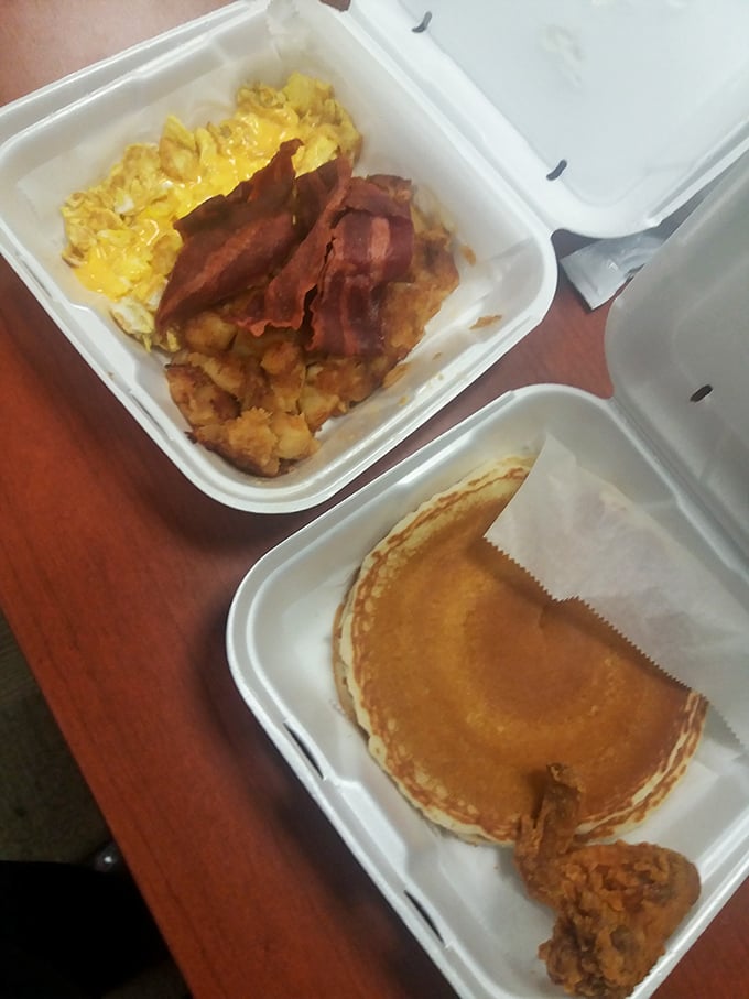 Breakfast perfection doesn't need fancy plating—just eggs, home fries, bacon, and a pancake that's ready for its close-up.