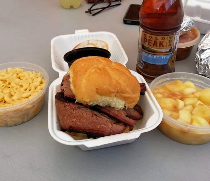 This brisket sandwich doesn't need Instagram filters – it's already got that natural, smoky glow. Mac and cheese sides looking equally ready for their close-up.