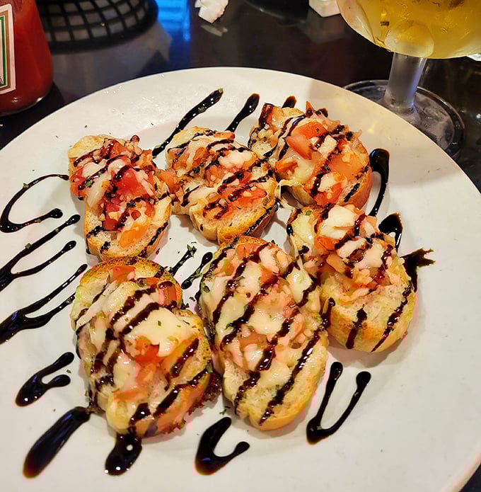 These bruschetta bites drizzled with balsamic glaze aren't trying to reinvent Italian cuisine—they're just perfecting it one toasted slice at a time.