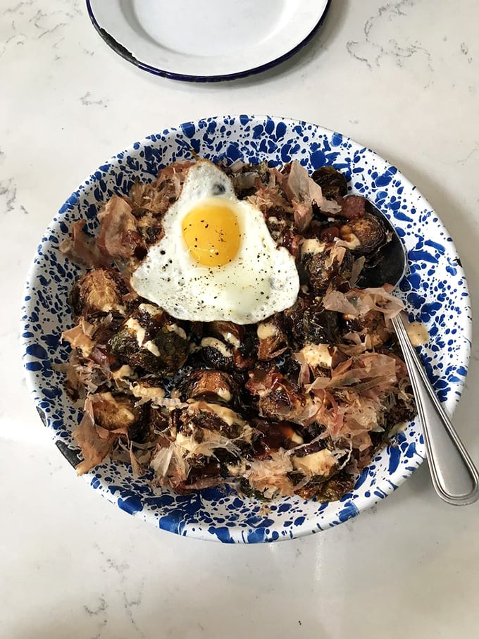 Brussels sprouts that could convert even the most dedicated vegetable skeptic, crowned with a perfectly fried egg and crispy bonito flakes dancing in the steam.