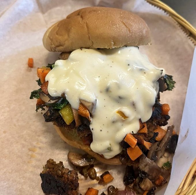 This isn't just a veggie burger—it's a masterpiece of melted cheese cascading over perfectly roasted vegetables like a dairy waterfall.