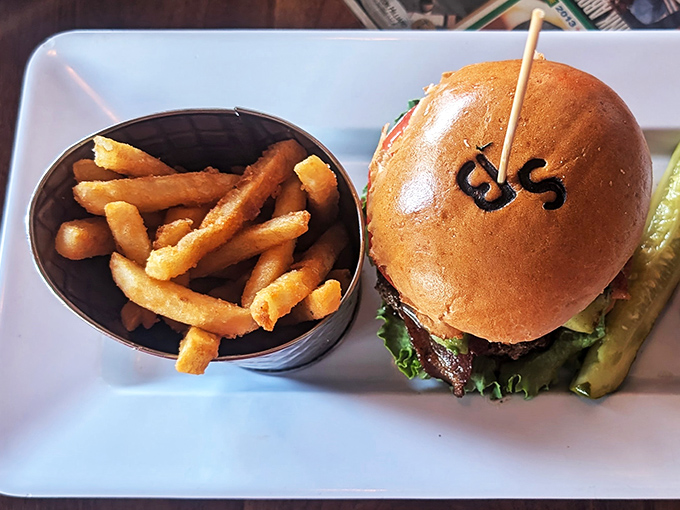 The burger arrives branded with the restaurant's initials – a delicious form of edible advertising that says, "Yes, we're that confident about our food."