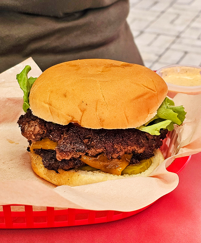 This isn't just a burger—it's a masterpiece of beef craftsmanship, with a perfect sear that would make even the most jaded food critic weak at the knees.
