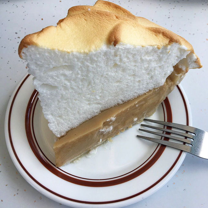Behold the butterscotch meringue pie—a cloud of sweet fluff floating above a golden custard sea. Worth every mile of the drive to Omaha.