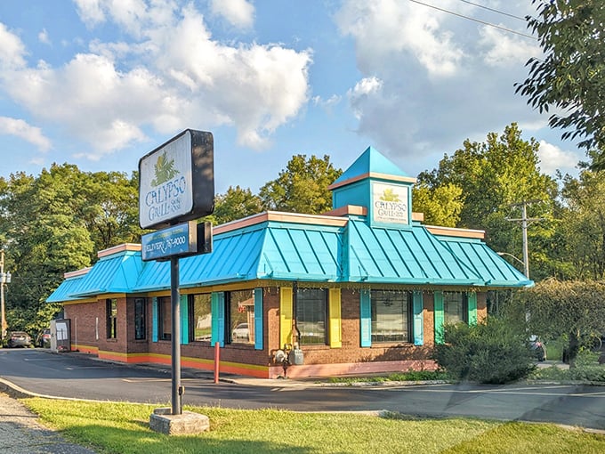 Calypso Grill's vibrant turquoise roof signals a departure from ordinary dining. This colorful outpost promises flavors as bold as its architecture.