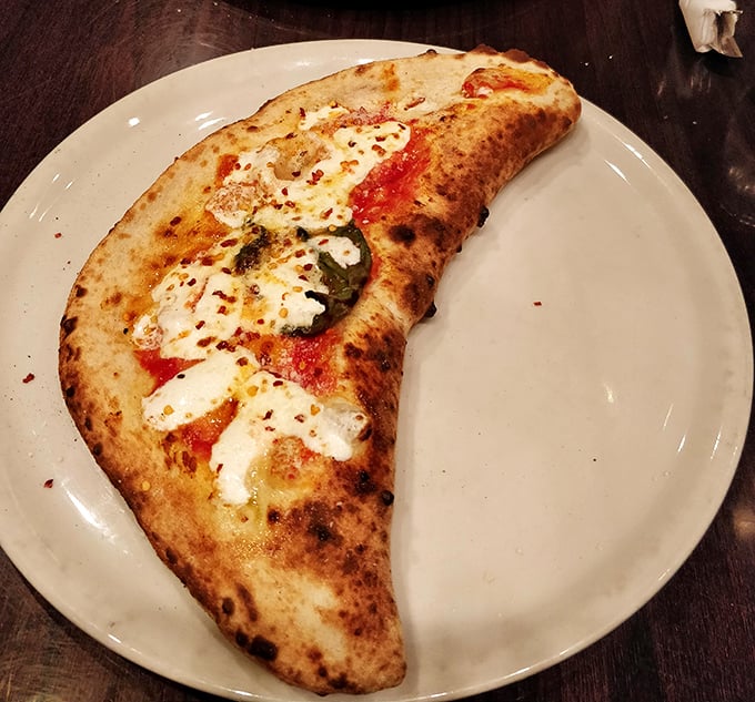 The calzone – pizza's sophisticated cousin who went to study abroad and came back with better table manners and deeper flavors.
