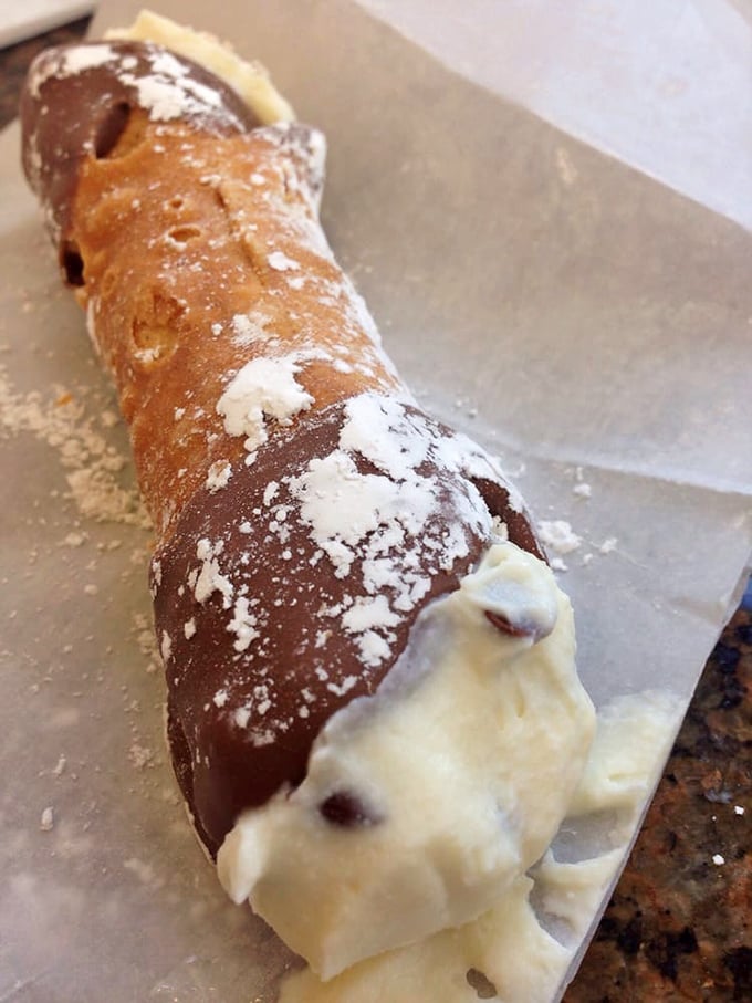 The humble cannoli – Sicily's gift to the world. That powdered sugar dusting isn't just for show; it's the dessert equivalent of a perfect snowfall.