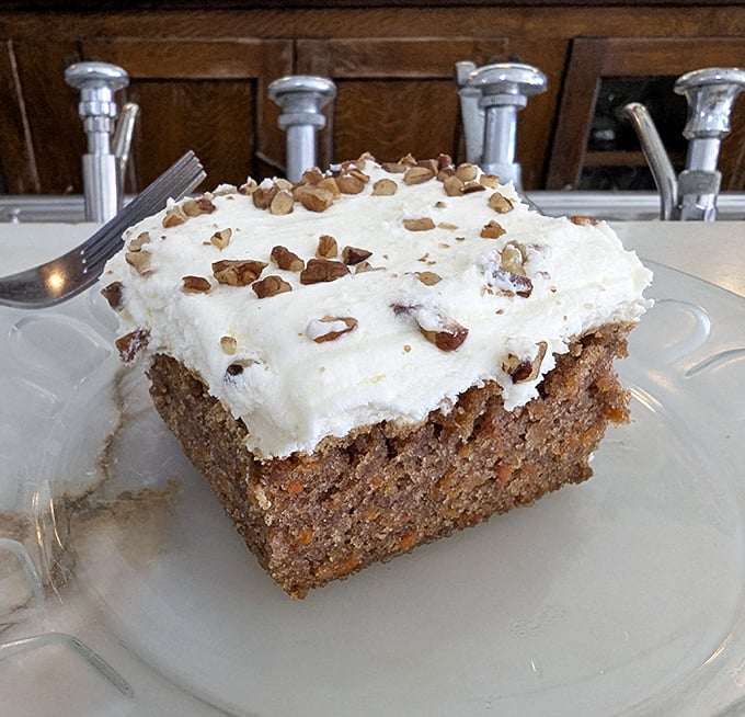 Carrot cake that doesn't just nod to grandma's recipe—it gives it a standing ovation with cream cheese frosting and pecan confetti.