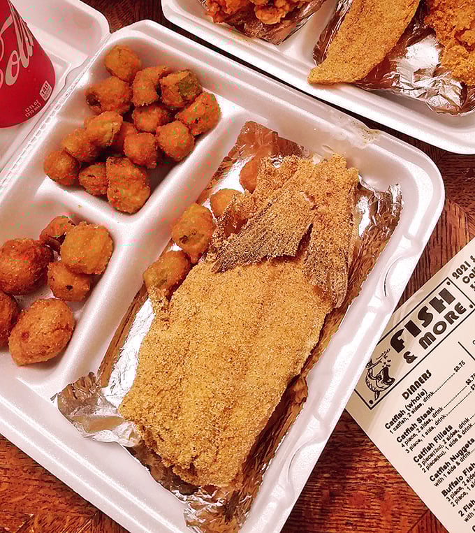 This isn't just dinner—it's edible architecture. Layers of golden-fried catfish, crispy hushpuppies, and fries create a comfort food masterpiece.
