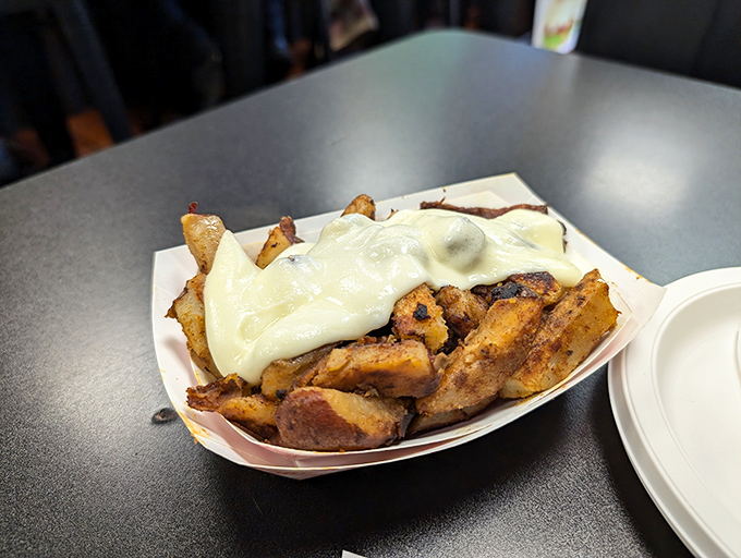 Cheese fries that don't apologize for their indulgence—the kind that make you forget you ever knew what cholesterol was.