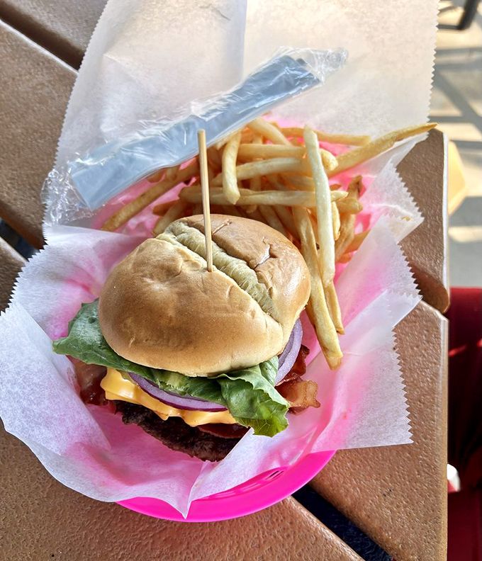 This isn't just a burger – it's architecture. Notice how the cheese drapes perfectly over the patty like a savory blanket ready for your taste buds.