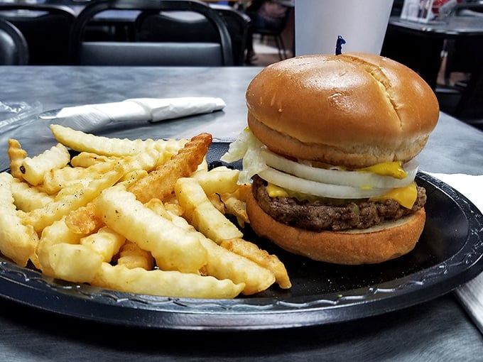 A proper diner burger doesn't need fancy aioli or artisanal buns—just honest ingredients stacked high enough to require jaw exercises beforehand.