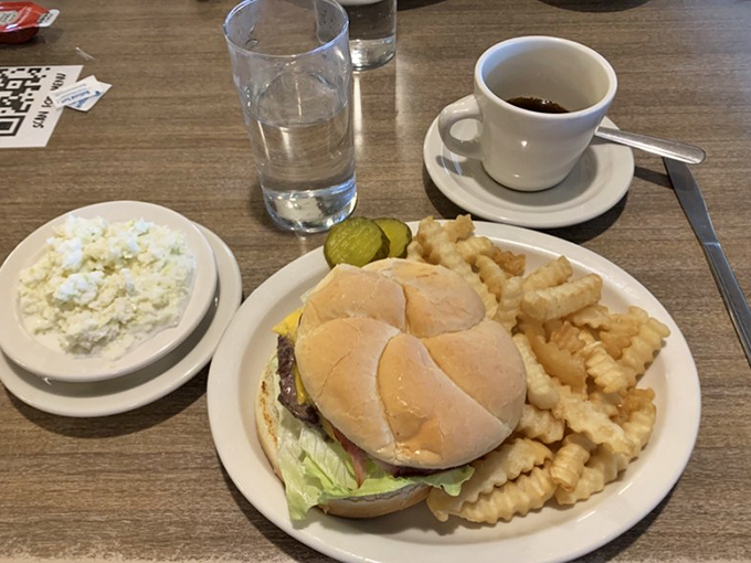 This isn't just a cheeseburger and fries—it's edible nostalgia on a plate, complete with those crinkle-cut potatoes that taste like childhood.