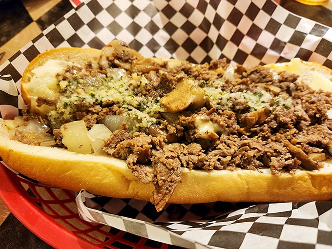 A proper cheesesteak should require a strategy to eat – this mountain of seasoned meat and melted cheese demands both hands and several napkins.