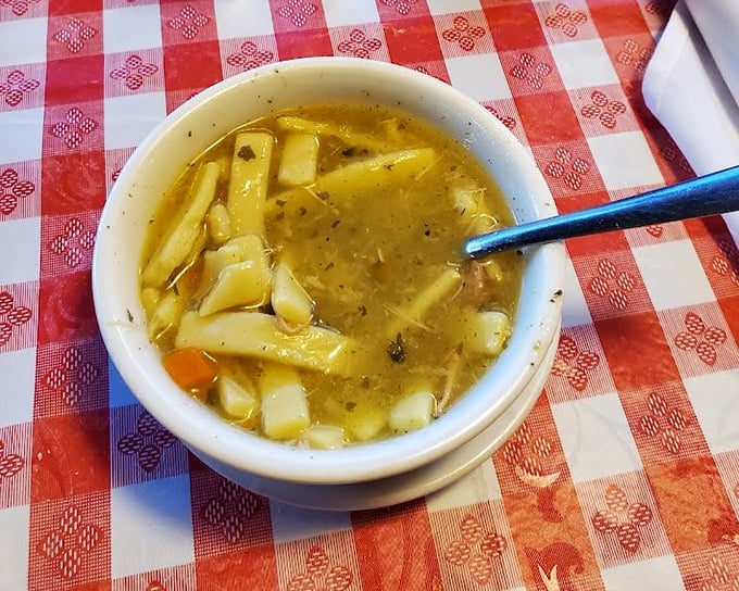 Chicken noodle soup that could make your grandmother jealous—thick, homestyle noodles swimming in broth that tastes like liquid comfort.
