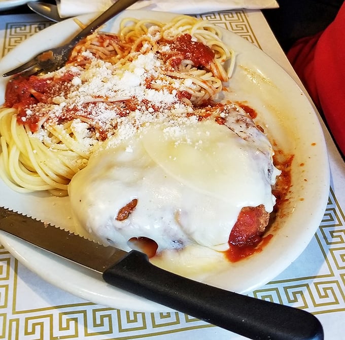 Chicken Parmesan that doesn't hide behind fancy plating – just honest-to-goodness Italian-American comfort draped in melted cheese and marinara glory.