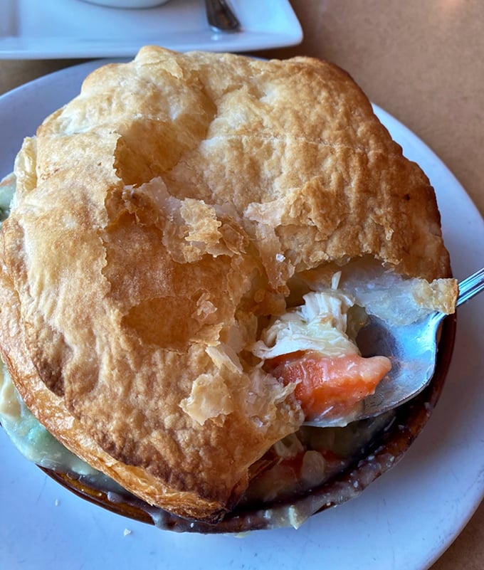 This chicken pot pie isn't just comfort food—it's a warm hug from your grandmother if your grandmother had a PhD in flaky crust technology.
