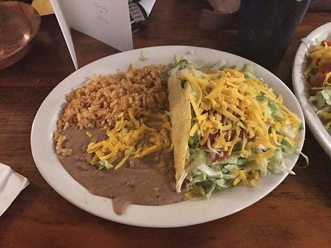 A proper taco plate comes with all the fixings—rice, beans, and enough cheese to make Wisconsin nervous.