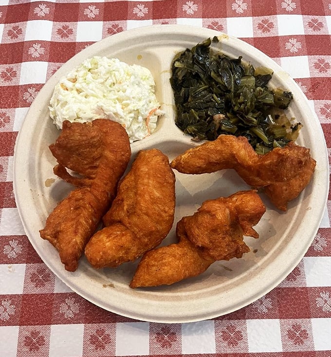 Tender strips of chicken alongside collard greens that have stories to tell. This plate doesn't need fancy plating—it's too busy changing lives.